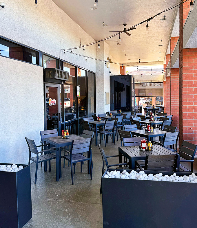 The outdoor seating area offers a chance to enjoy your towering sandwich under the Arizona sky, with string lights ready to illuminate your evening feast.