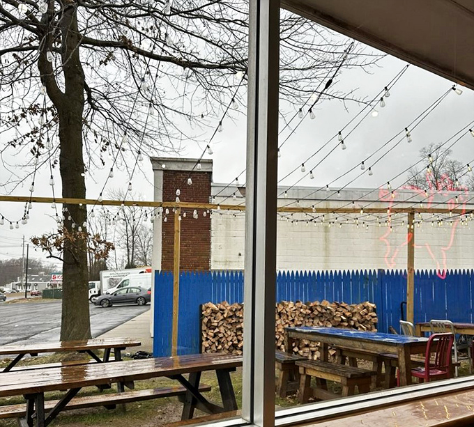 Even on a gray day, the stacked firewood outside tells you everything &ndash; real smoke, real wood, real barbecue. No shortcuts to greatness here.