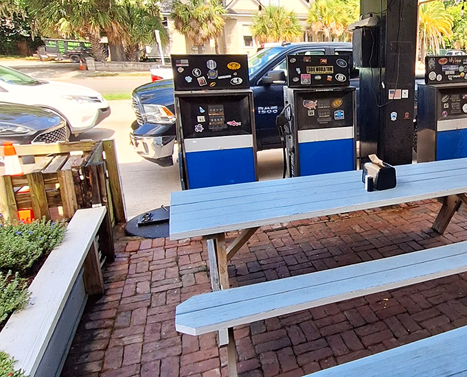 Where vintage gas pumps meet picnic tables, creating the perfect setting for the kind of meal that makes you forget about your phone.