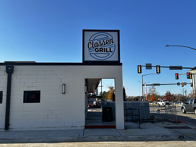 The iconic Classen Grill sign stands sentinel at the intersection, beckoning hungry travelers toward breakfast nirvana in Oklahoma City.