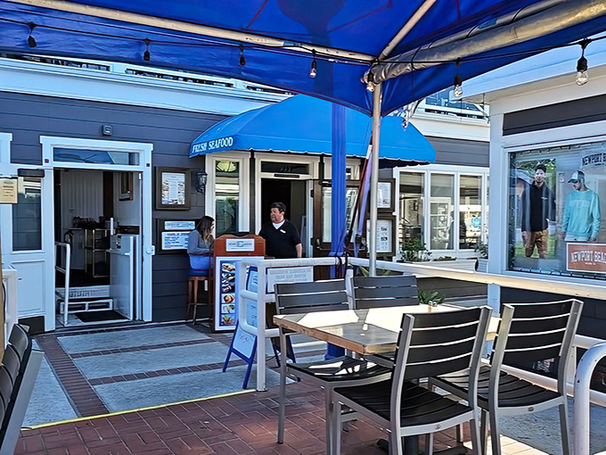 The welcoming outdoor patio beckons with its blue awning and wooden tables &ndash; the perfect spot to people-watch while waiting for your clam chowder fix.