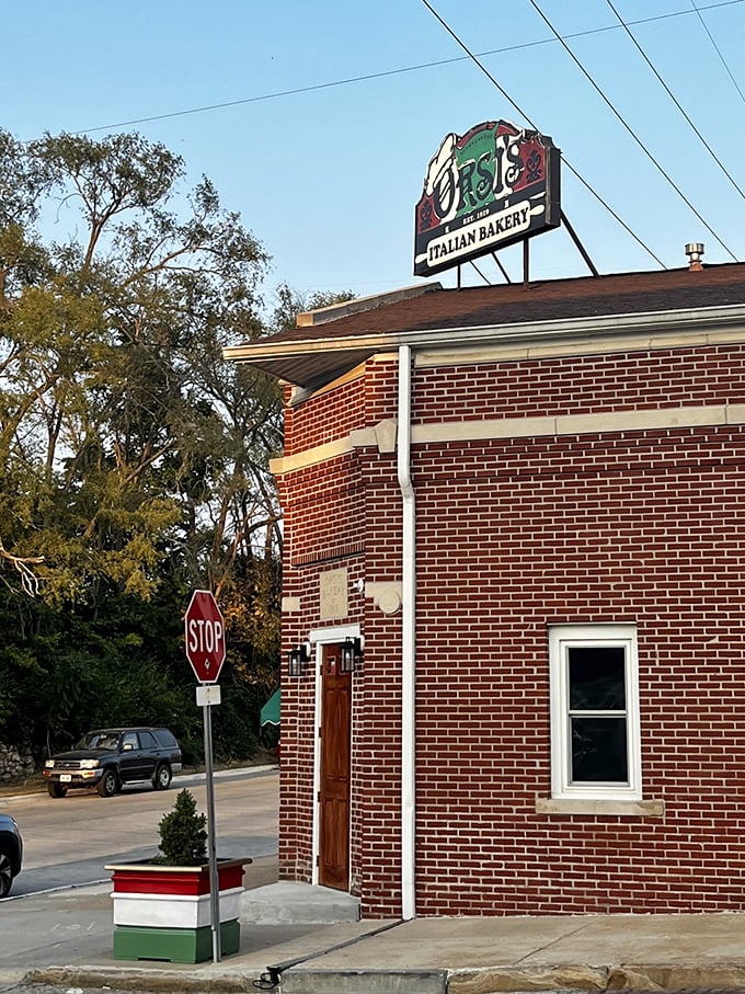 The corner building standing strong, announcing Italian excellence to the neighborhood like a delicious beacon of hope and hunger.