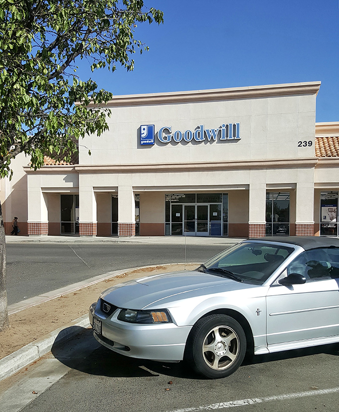 The exterior view with a car for scale&mdash;proof that you really should bring the bigger vehicle for your thrifting expedition.