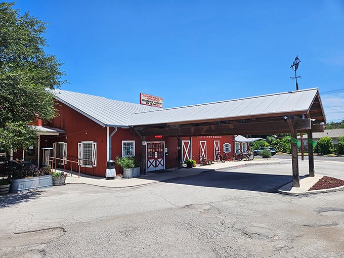 That daytime view shows the full barn charm complete with covered parking area, making it easy to spot from the road.