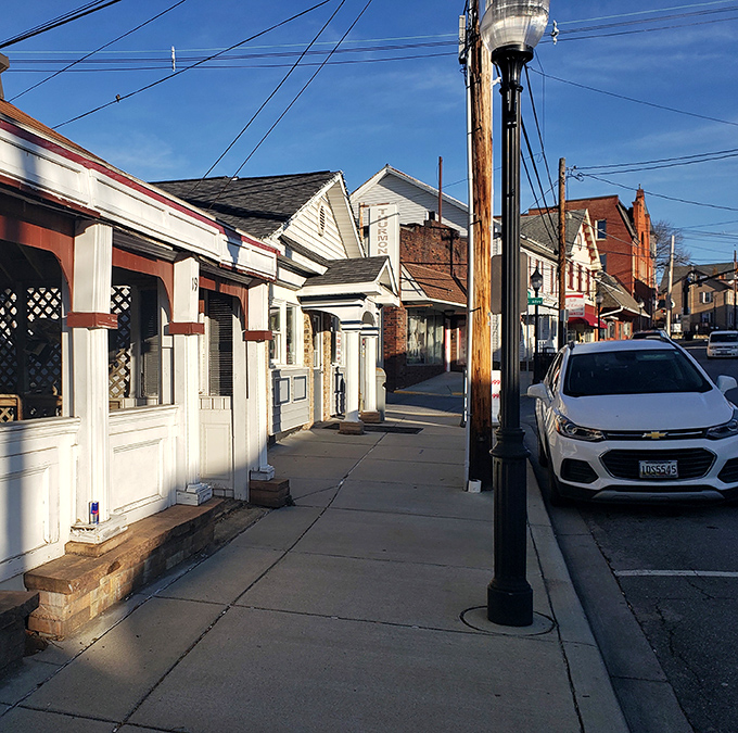 Morning light bathes the quiet street, where Thurmont's small-town charm sets the perfect stage for the culinary treasures waiting inside.