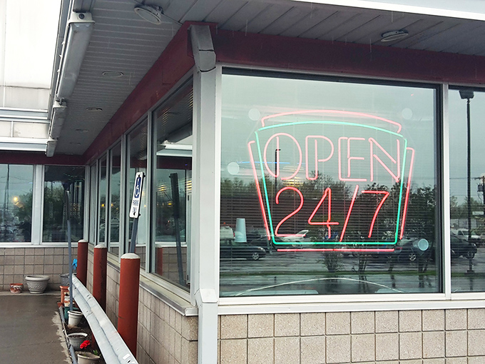The neon "OPEN 24/7" sign isn't just information&mdash;it's a promise that comfort food awaits no matter when hunger or insomnia strikes.