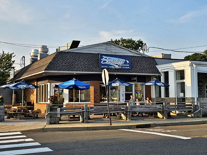 The Sandpiper at golden hour—when the restaurant glows like a beacon for seafood pilgrims seeking lobster roll enlightenment.