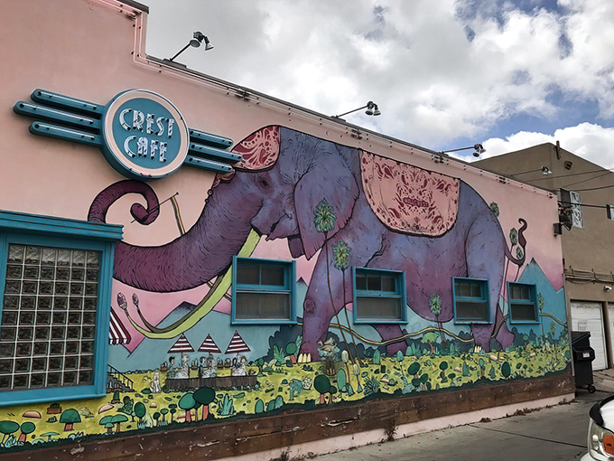 The famous elephant mural wraps around the building like a storybook illustration, making Crest Cafe impossible to miss and even harder to forget.