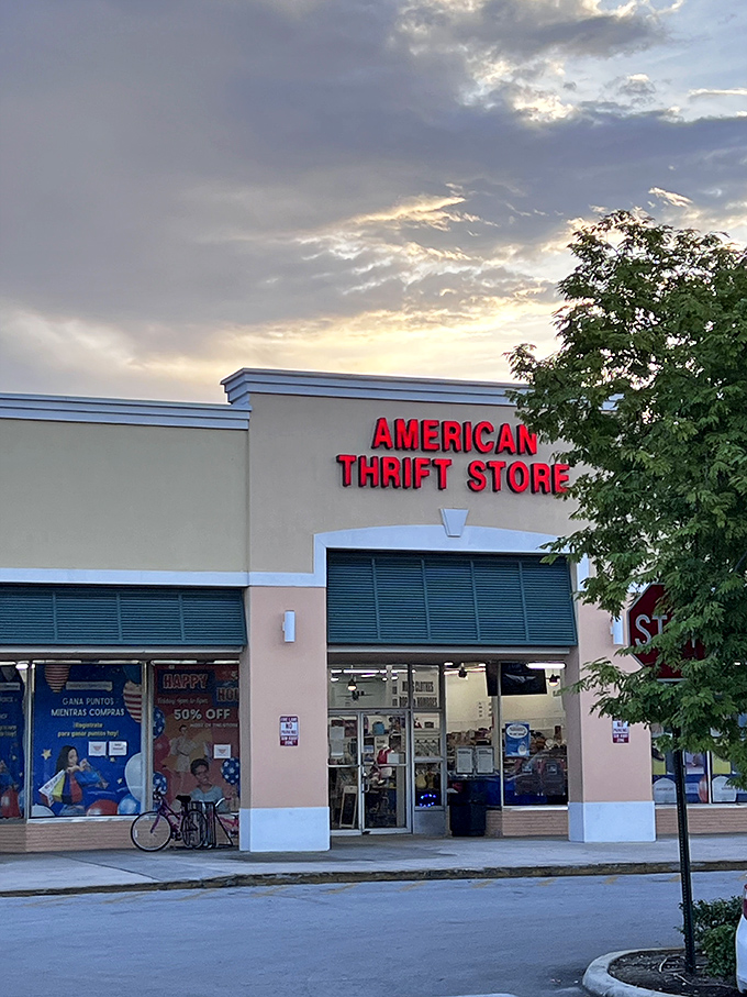 As the Florida sun sets, American Thrift Store's iconic sign glows with the promise of tomorrow's undiscovered bargains waiting just inside.