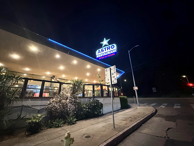 At night, Astro's neon star glows like a beacon for the hungry, the sleepless, and anyone in need of a slice of pie and a moment of peace in the city.