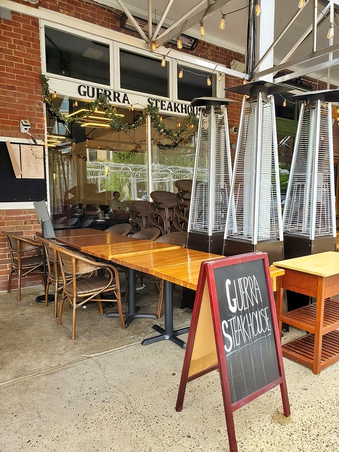 A simple chalkboard sign and wooden tables mark the entrance to culinary excellence&mdash;no flashy gimmicks needed when the food speaks for itself.