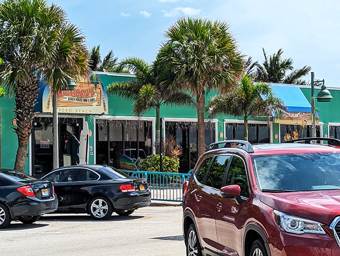 Palm trees stand guard over outdoor dining tables, where the ocean provides both the view and the main ingredients for your meal.