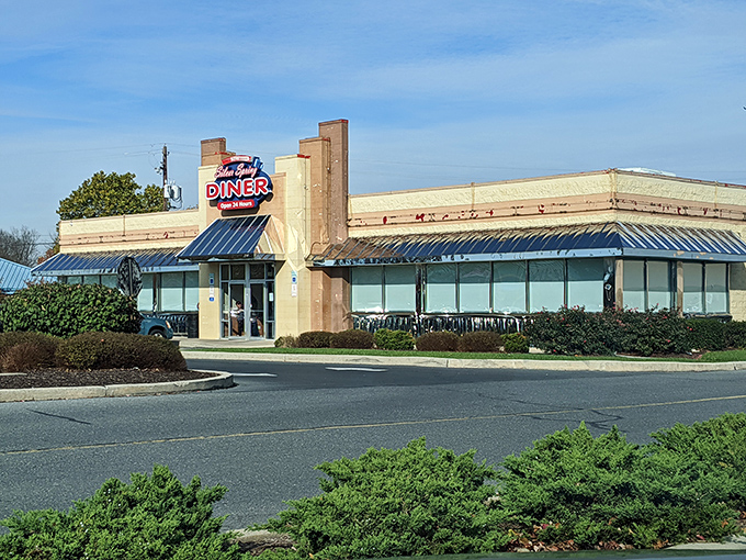 The exterior view on a sunny day&mdash;when the diner looks like it's posing for its glamour shot. Architectural curb appeal that says "pull over now."