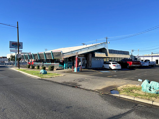 The distinctive silhouette of Mel's Diner against a blue Yakima sky &ndash; a landmark that's been filling bellies and creating memories for generations.