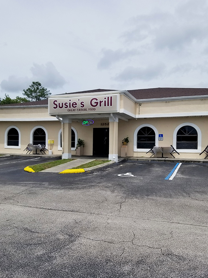 Even on cloudy days, Susie's Grill's "OPEN" sign glows like a beacon of hope for the hungry traveler seeking refuge from chain restaurant mediocrity.