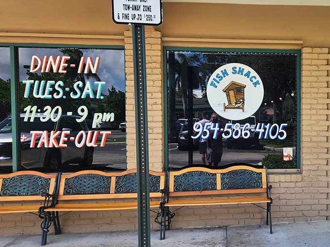 The window announces the simple truth: Tuesday through Saturday, this is where you'll find seafood paradise. The bench is for those who didn't call ahead.