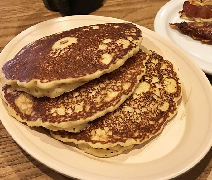 These golden pancakes aren't just breakfast; they're edible sunshine stacked three high&mdash;fluffy enough to make clouds jealous.