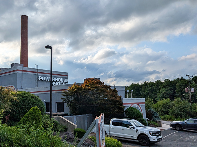 The dramatic sky frames this repurposed power plant perfectly&mdash;a structure that once energized a community now fuels memorable dining experiences instead.