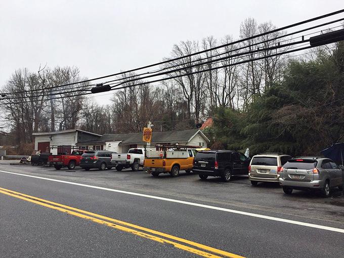 A parking lot full of vehicles tells the real story&mdash;when locals line up like this, you know you've found the genuine article. BBQ democracy in action. 