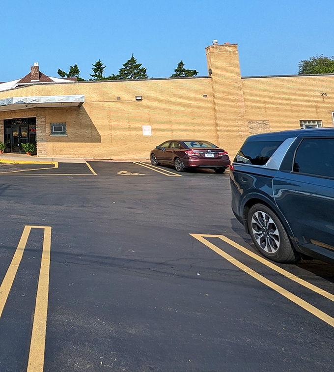 The unassuming parking lot&mdash;final barrier between you and carbohydrate nirvana. Many enter with good intentions; all leave with white bakery boxes.