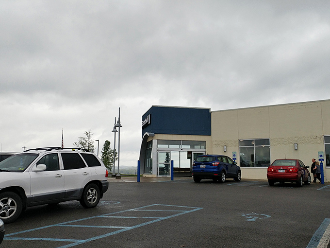 The parking lot of possibility. Each car represents someone arriving with hope or leaving with treasures, all under those dramatic West Virginia skies.
