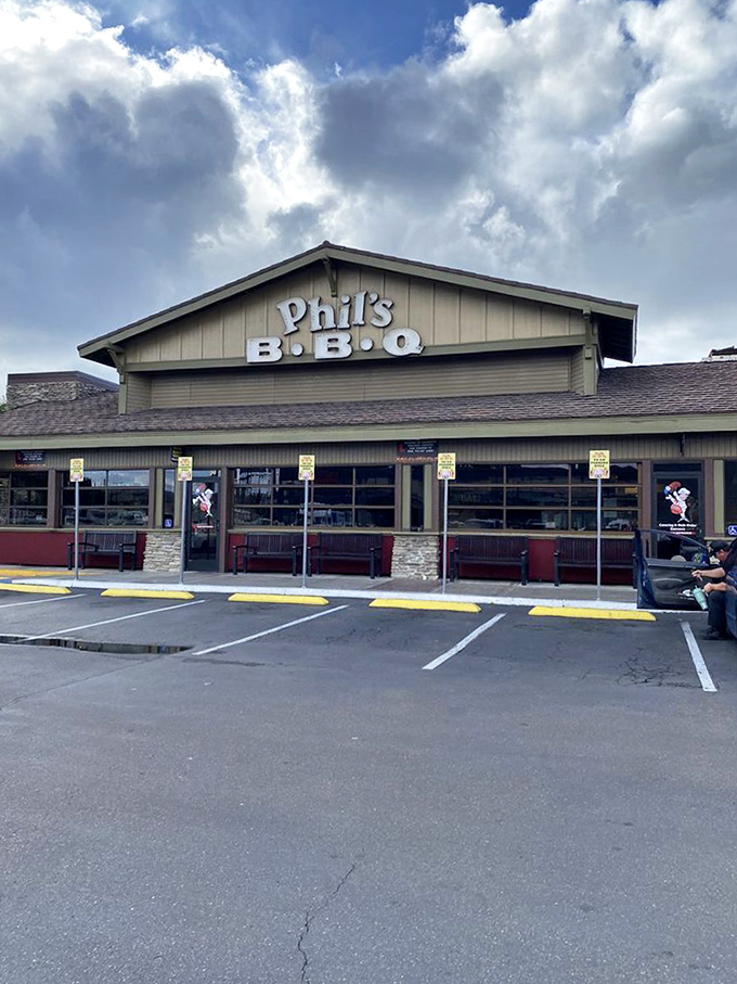 The parking lot—where the journey begins and where you'll later waddle back, belt loosened, carrying leftovers like precious cargo.