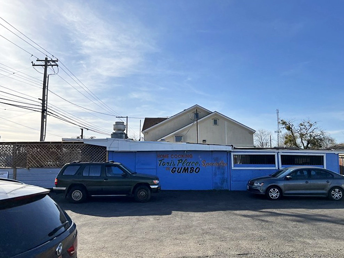 From the parking lot, that signature blue exterior with "Tori's Place Specializes in GUMBO" is like a beacon calling to hungry souls across Sacramento.
