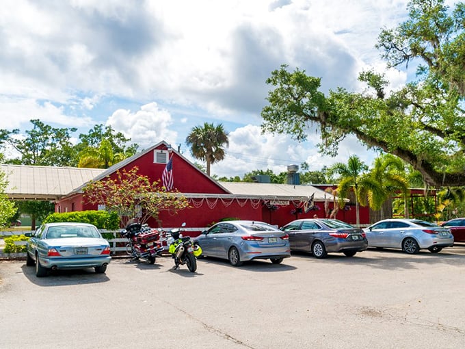A full parking lot is the most honest restaurant review. Under palm trees and Spanish moss, cars gather like pilgrims at a culinary shrine.