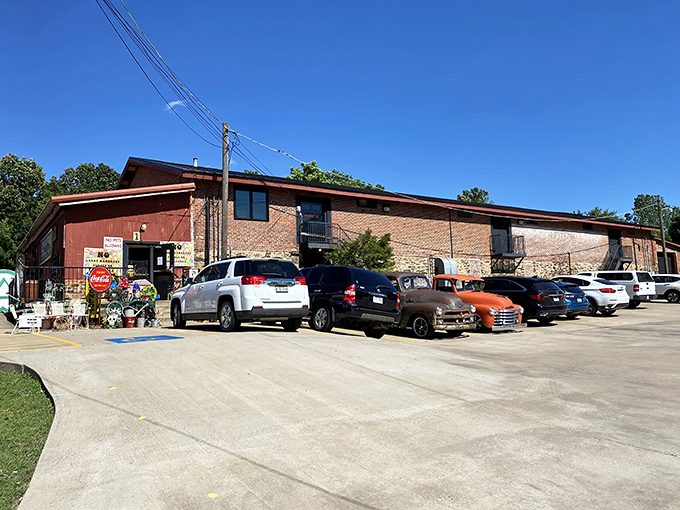 The parking lot tells the story: vintage trucks beside modern SUVs, where treasure hunters of all generations converge with empty trunks.
