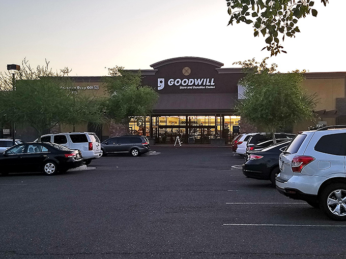 As evening approaches, the Goodwill's glow beckons shoppers for one last treasure hunt&mdash;tomorrow's inventory will tell completely different stories.