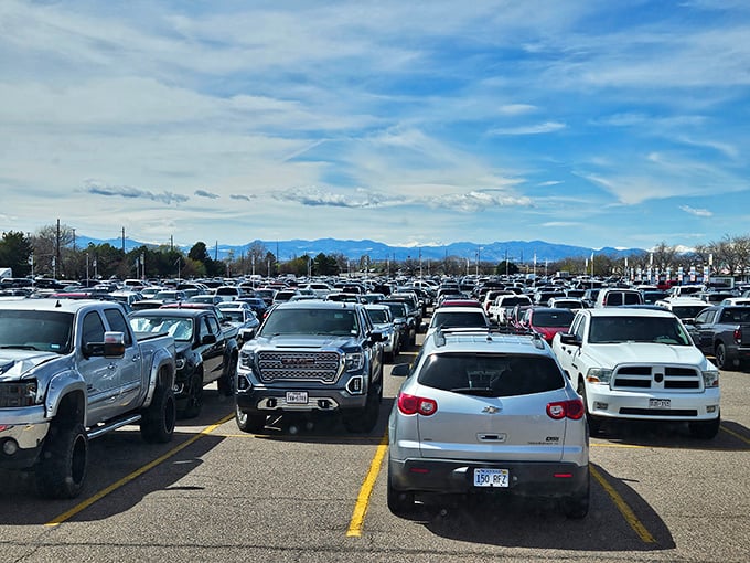 The parking lot stretches toward mountain vistas &ndash; a sea of vehicles beneath Colorado's majestic Front Range.