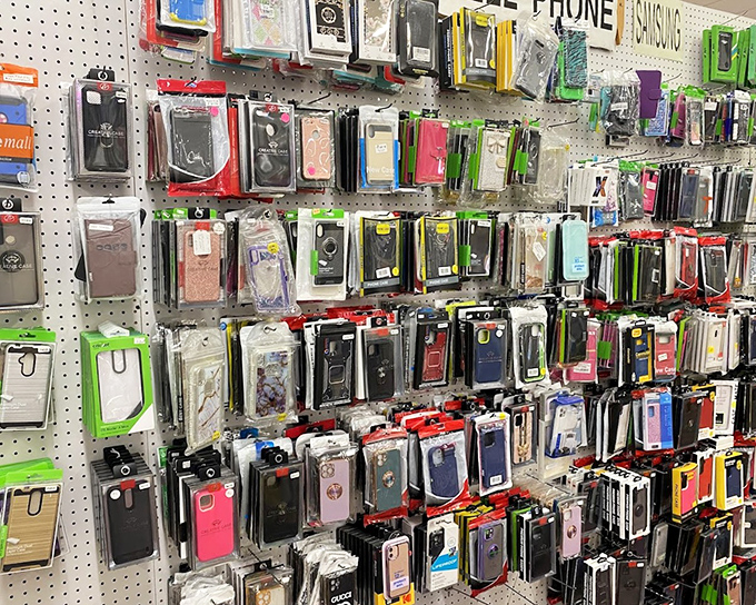 The wall of phone protection offers more options than a paint color chart. Finding your perfect case here is like a personality test you can actually use.