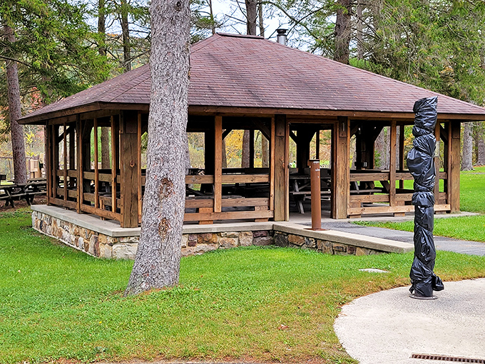 Shelter from sudden summer storms. This pavilion has witnessed countless family reunions, with their potato salad competitions and three-generation volleyball matches.