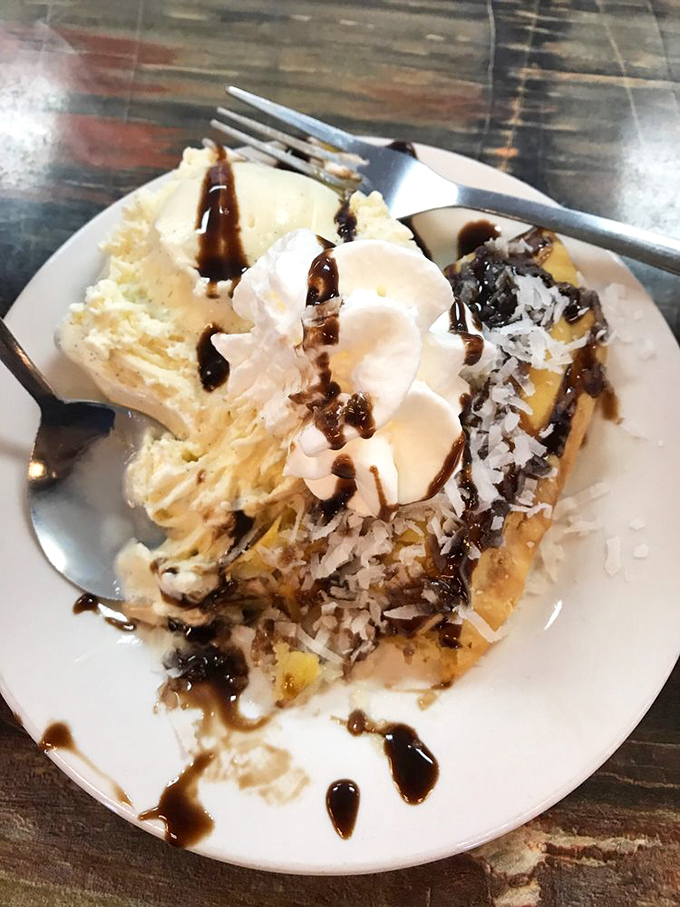 This isn't just dessert&mdash;it's a slice of coconut pie that makes time stand still, with whipped cream melting into warm chocolate drizzle.