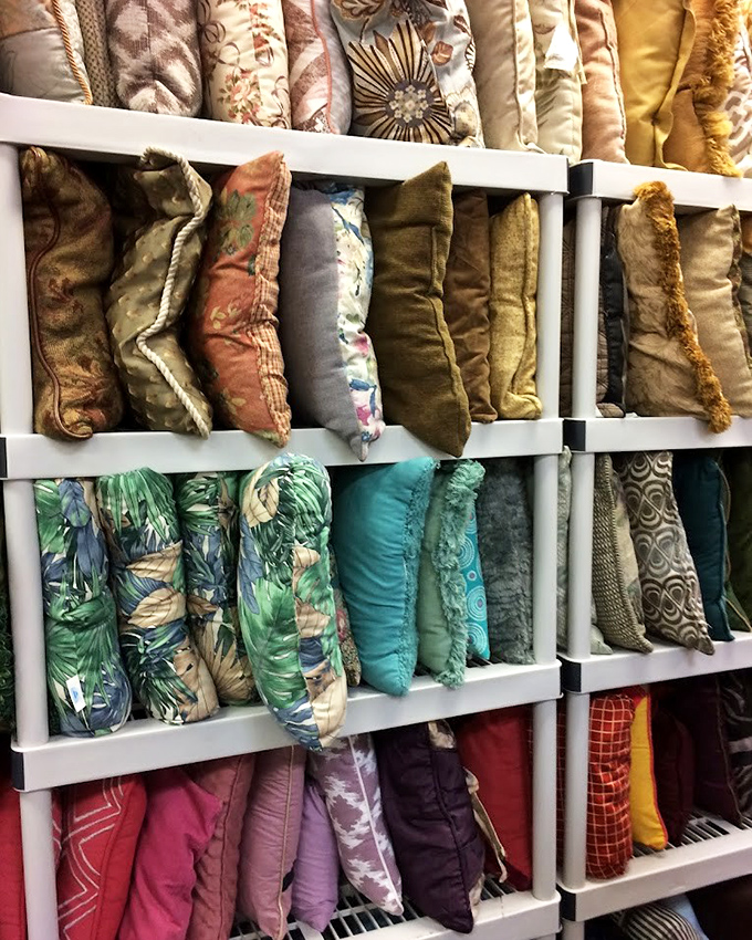 A rainbow of throw pillows stacked with military precision. Your couch makeover is just $30 away, and you'll still have money left for coffee.