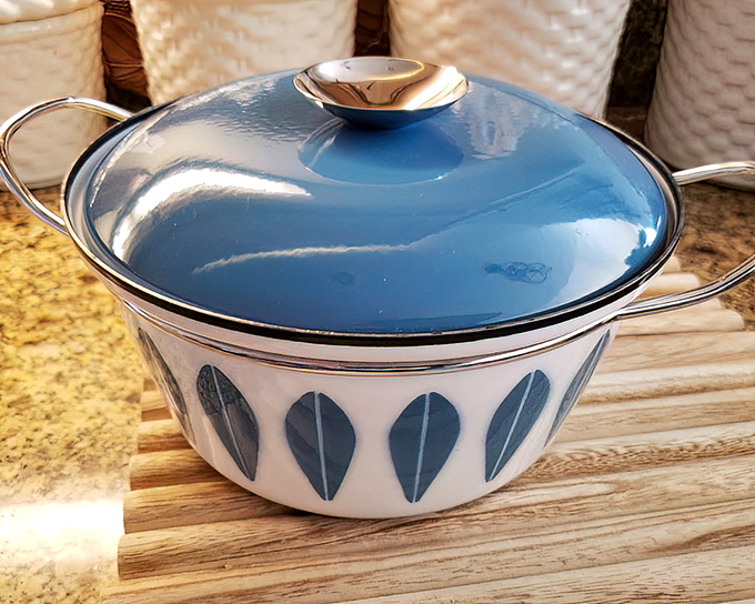 Mid-century modern meets kitchen functionality. This blue-lidded beauty once simmered someone's grandmother's famous stew&mdash;now it's ready for your culinary adventures.