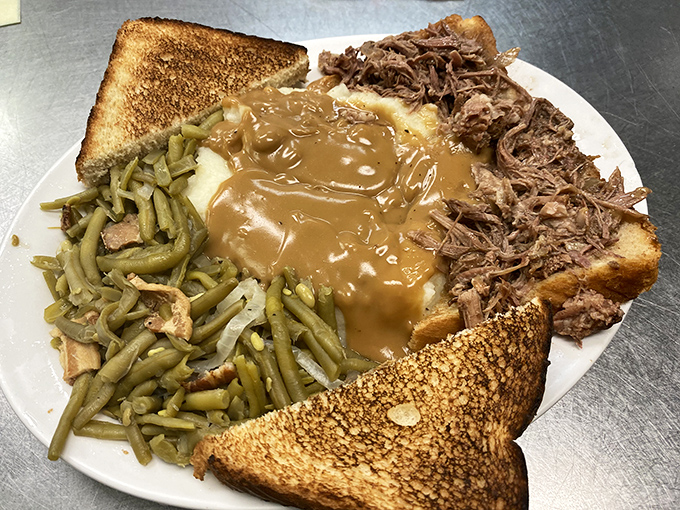 This isn't just a plate&mdash;it's a Southern symphony. Pulled pork, green beans, mashed potatoes under gravy, and toast standing by for cleanup duty.
