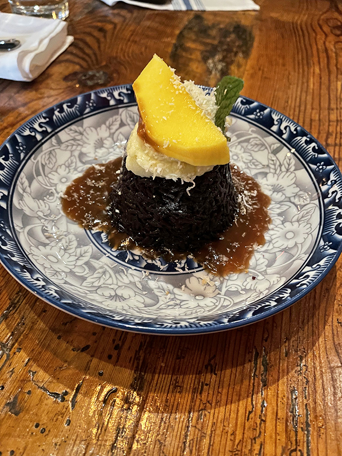 The black sticky rice dessert topped with mango and coconut cream is the grand finale your taste buds deserve&mdash;sweet, tropical, and utterly unforgettable.