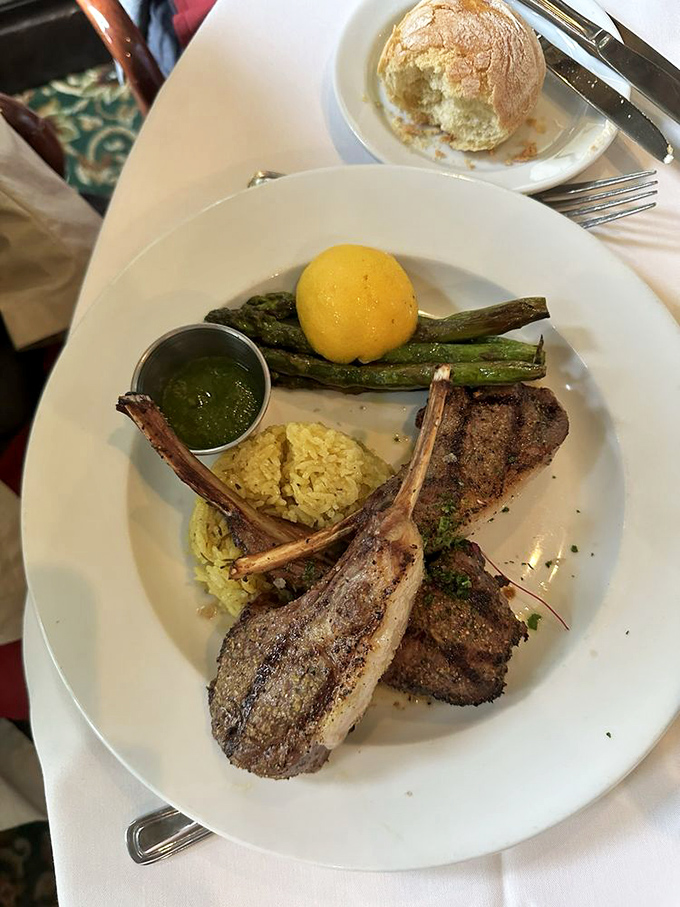Rack of lamb cooked to pink perfection, served with asparagus and rice pilaf&mdash;a dish that proves some classics deserve their permanent place in the culinary pantheon.