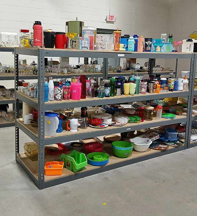 The miscellaneous section—where water bottles, kitchen gadgets, and plastic containers find new purpose. One person's clutter becomes another's solution.