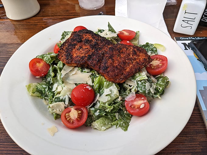 Blackened salmon that could convert a vegetarian. Perfectly seasoned, flaky fish atop a crisp Caesar salad &ndash; proof that healthy can be indulgent too.