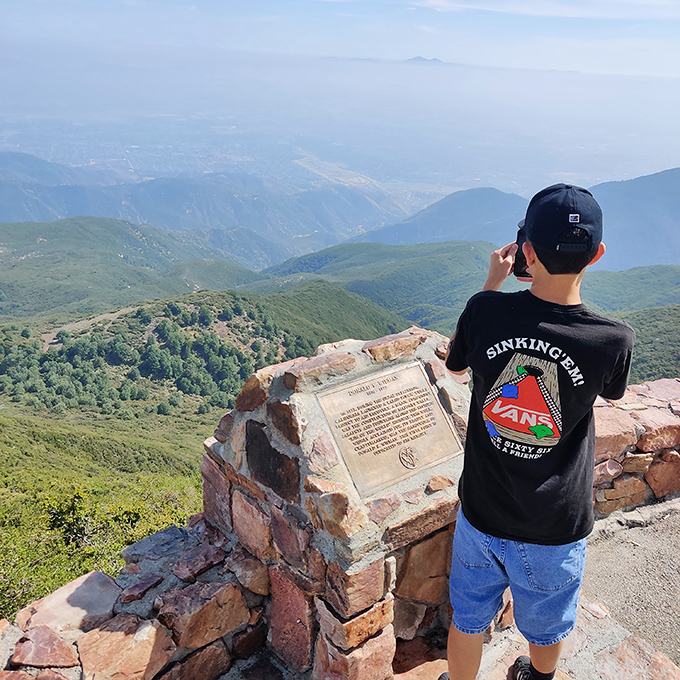 Young explorer taking in views that no smartphone screen could ever do justice. Some memories need full-size storage.