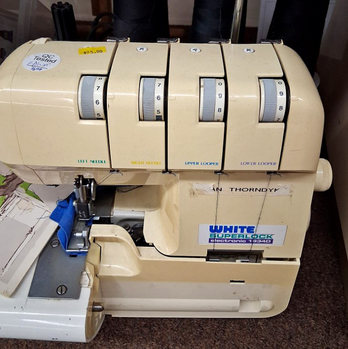 A White Superlock that's survived the fashion apocalypse. This sturdy machine is ready to hem your pants while reminiscing about the '90s.