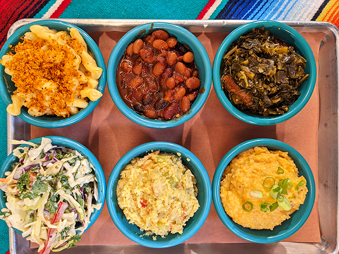 A color-coordinated symphony of sides in their turquoise bowls. Mac and cheese, beans, greens&mdash;the supporting cast that steals the show.