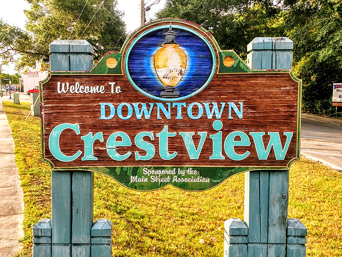 Downtown Crestview's welcome sign promises small-town charm with a wink – the kind of place where everybody might actually know your name.