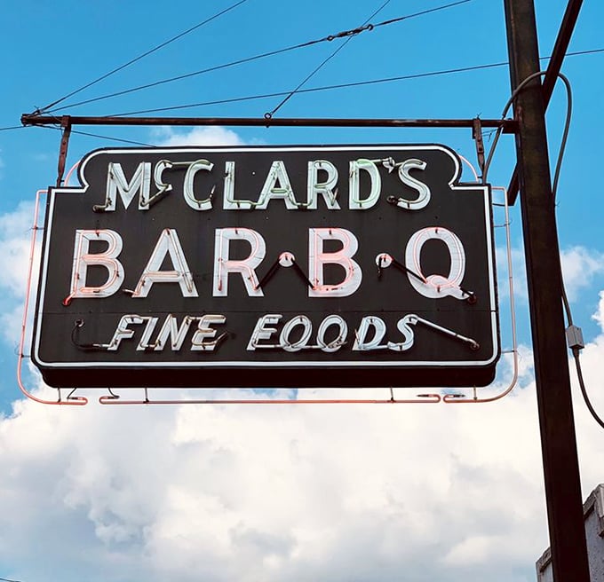 That iconic sign against an Arkansas sky&mdash;a beacon of hope for those seeking authentic barbecue in a world of pretenders.