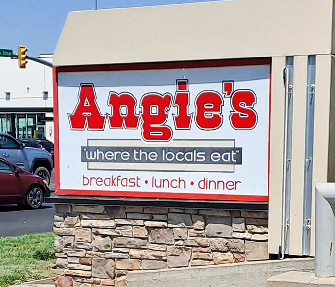 The roadside sign stands as a beacon of hope for hungry travelers &ndash; breakfast, lunch, and dinner salvation awaits within.