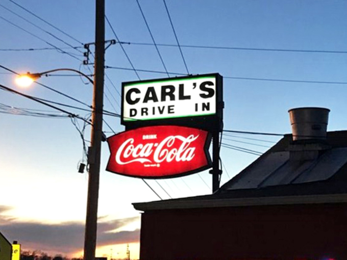 The illuminated sign glows like a beacon in the twilight, guiding hungry pilgrims to one of Missouri's most beloved food institutions.