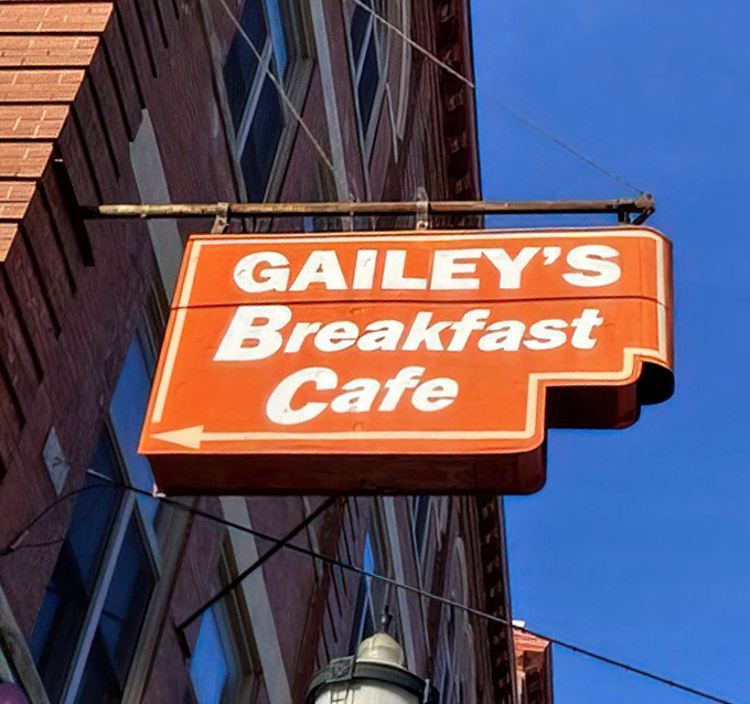 Against the blue sky, Gailey's sign promises breakfast salvation just around the corner. Follow the arrow to happiness, served with coffee.