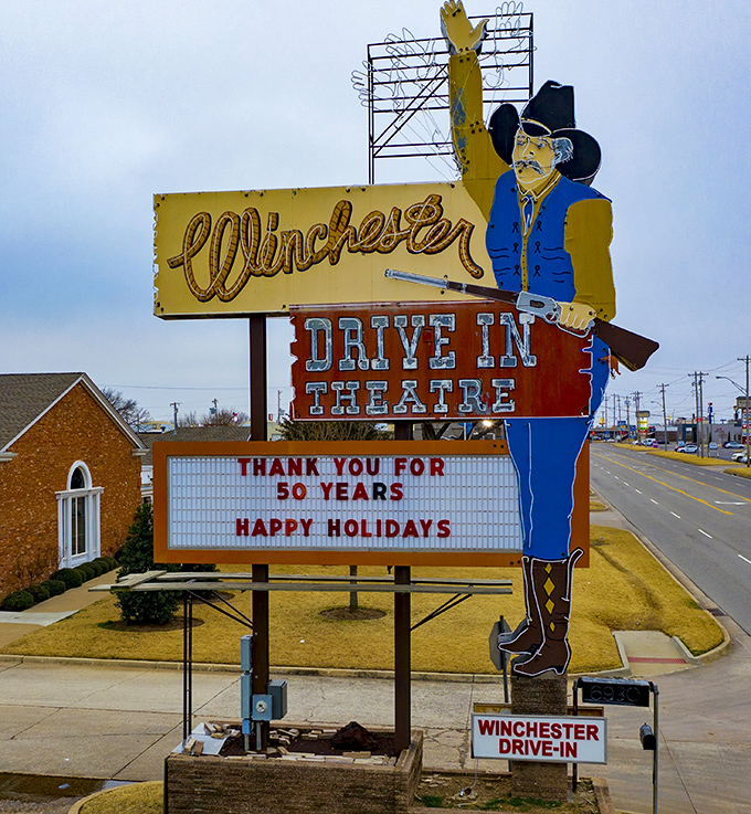 The Winchester cowboy stands tall along South Western Avenue, a sentinel of cinema history who's witnessed fifty years of first dates and family outings.